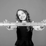 Kid school uniform hold ruler. Pupil cute girl with big ruler. Geometry ...