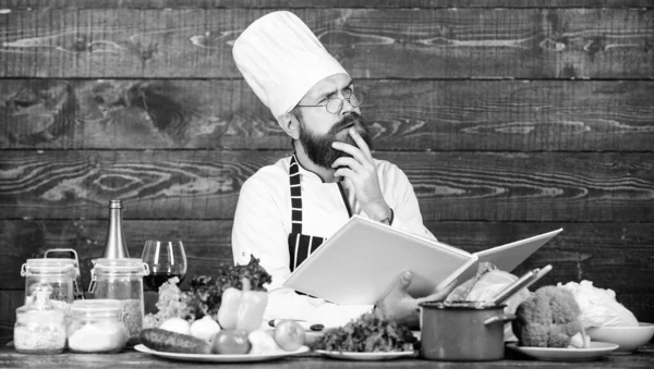 Guy read book recipes. Culinary arts concept. Man learn recipe. Try ...