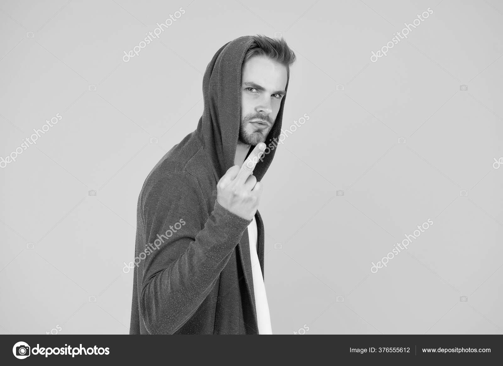 Rude and bad. Rude guy show middle finger yellow background. Rude hand ...