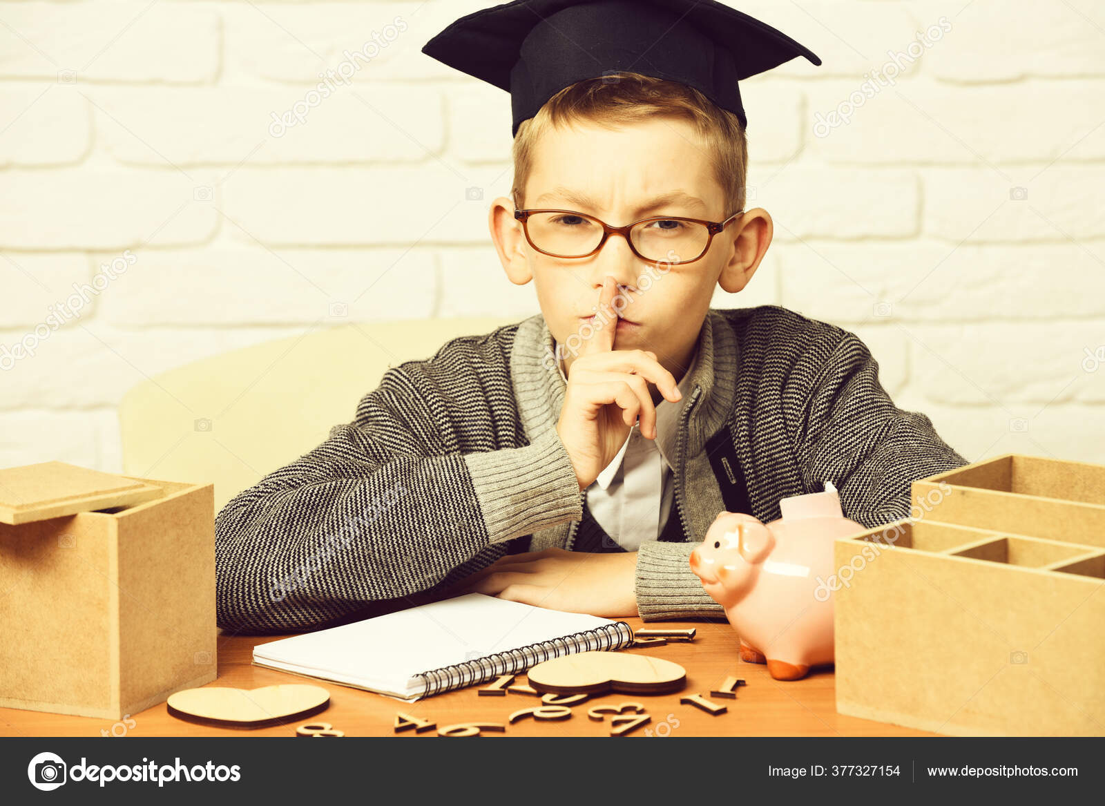 Young cute little pupil boy on white brick wall background Stock Photo ...