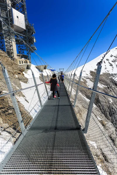 Suspension bridge on Titlis Mountain. Stock Photo by ©amnachphoto 157911686