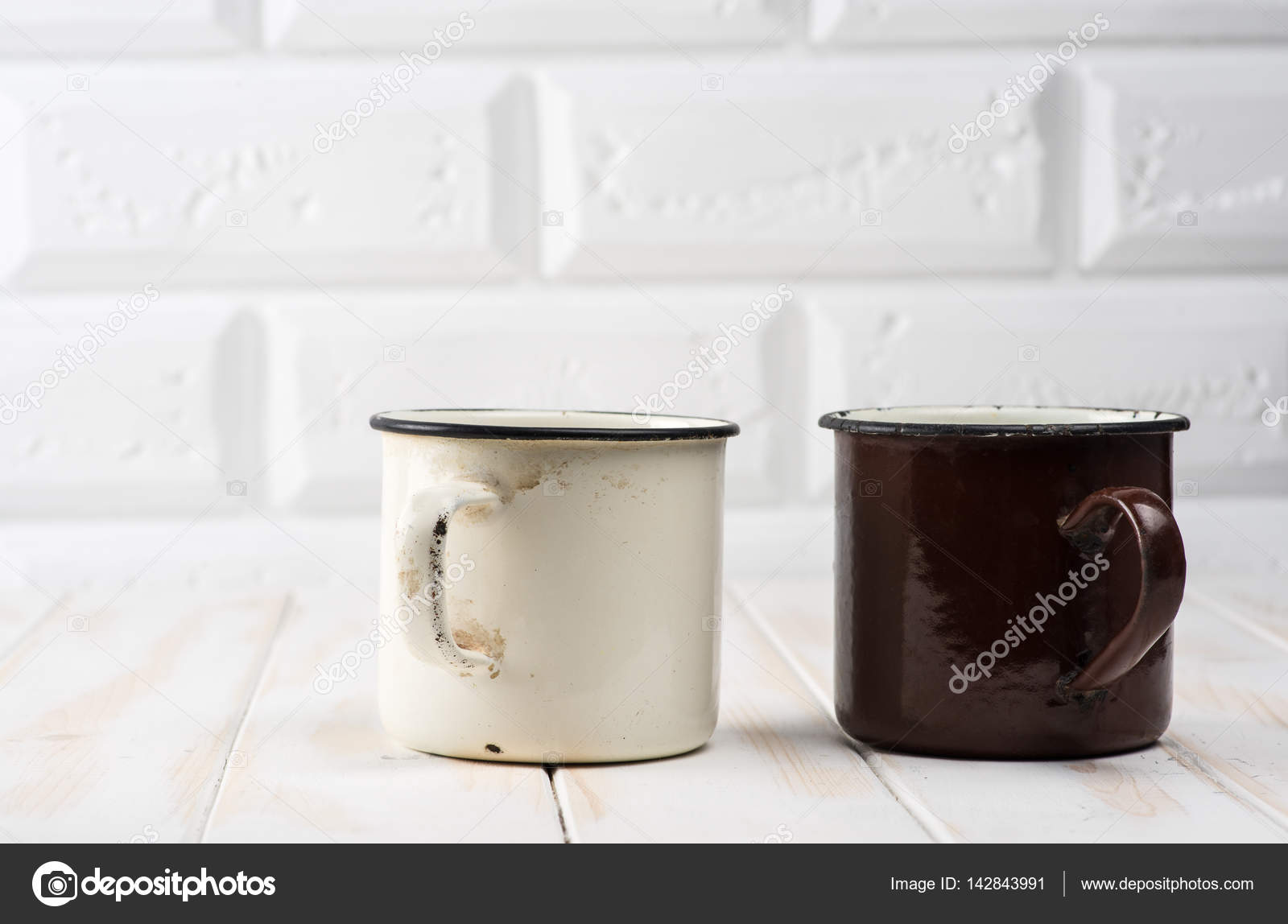 Two mugs on table Stock Photo by ©olegkrugllyak 142843991