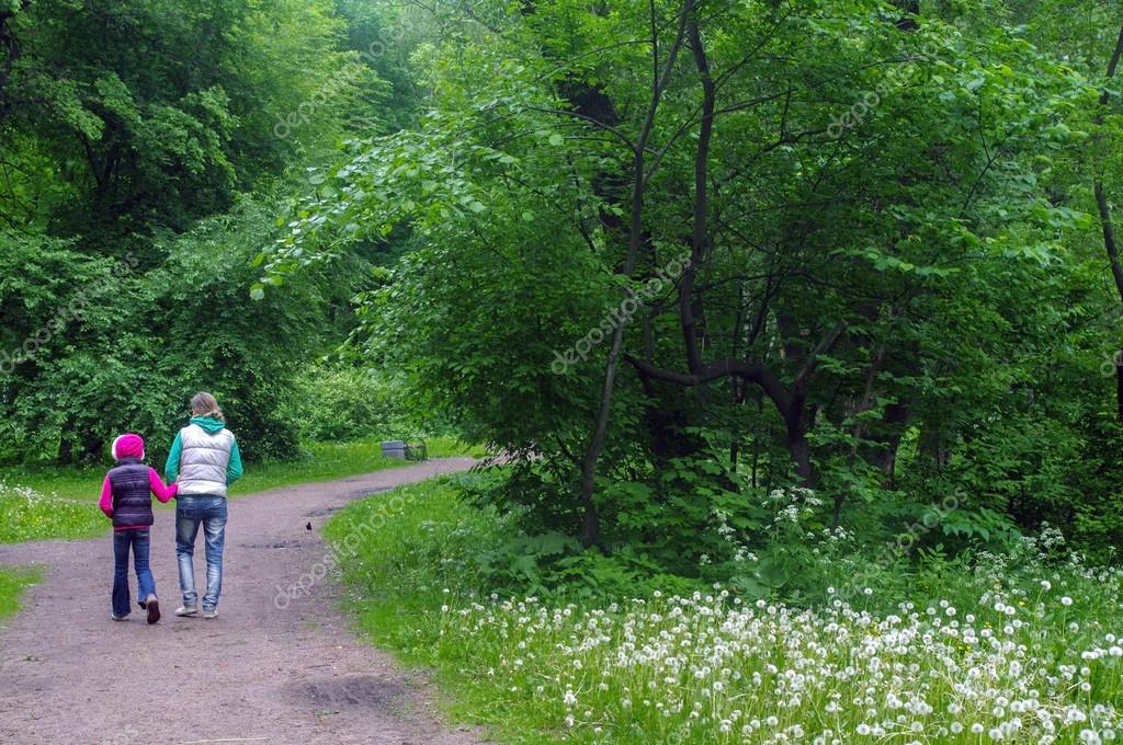 Mother and daughter walking in the forest holding hands — Stock Photo © evolutionnow #127138898