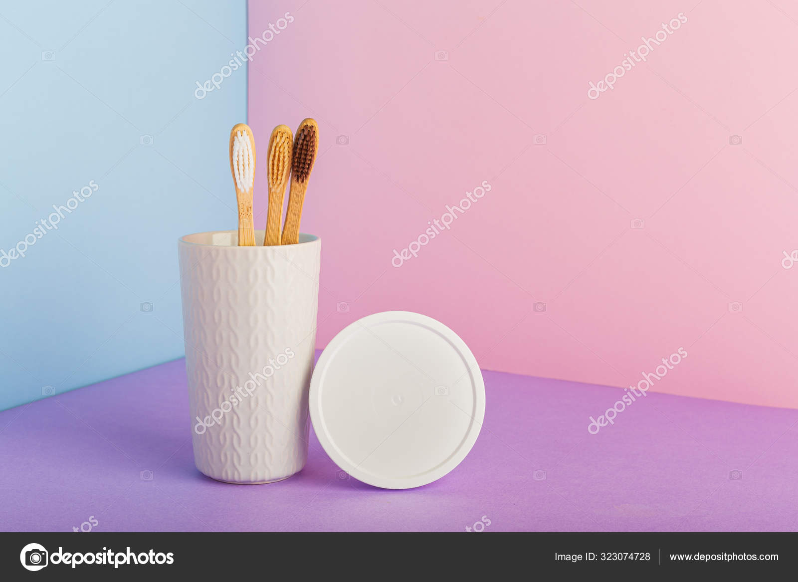 Bamboo toothbrushes and dentifrice tooth powder on color pink ...