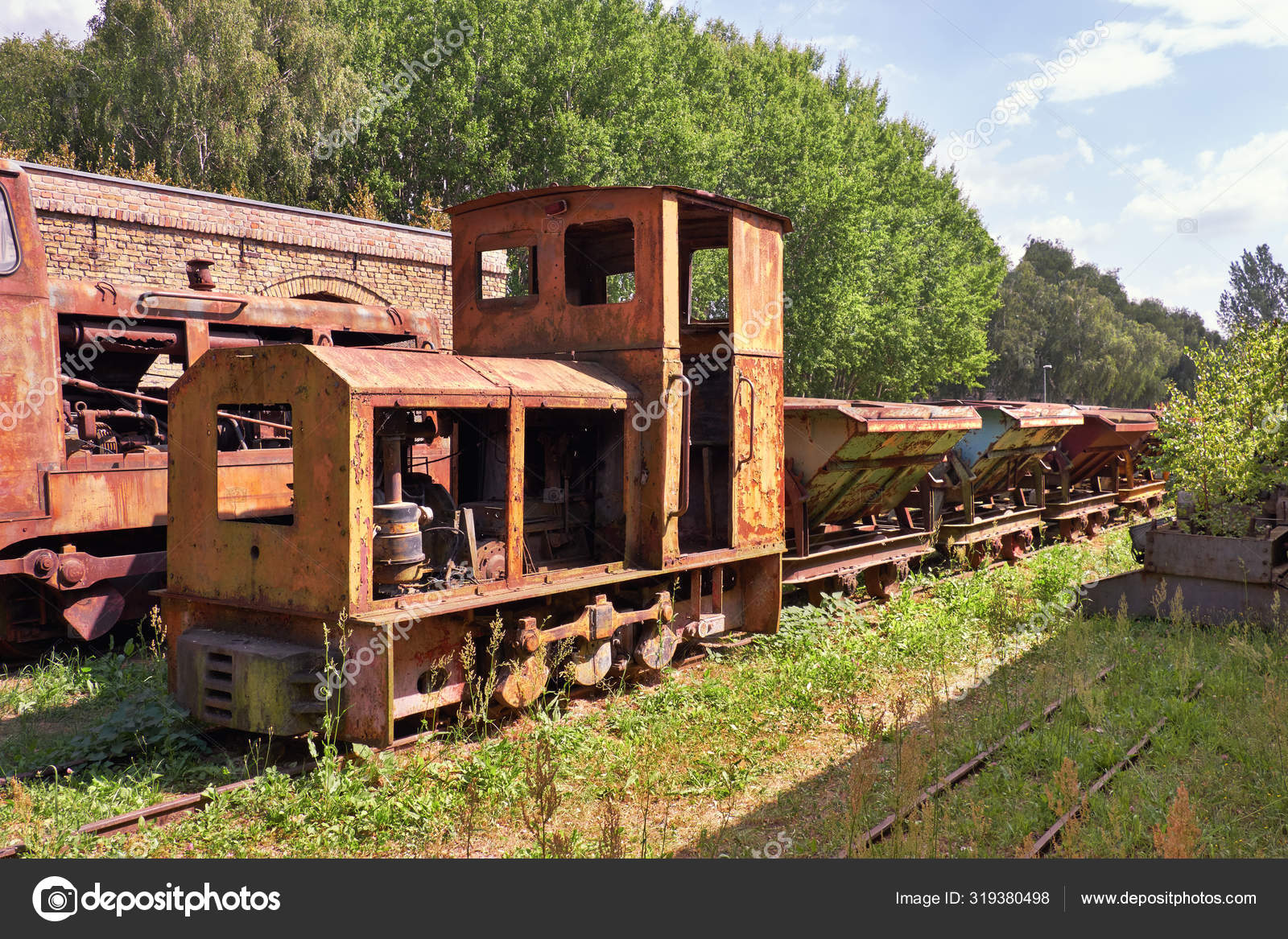Derelict and rusting steam train and coal vagons at the historic Stock ...