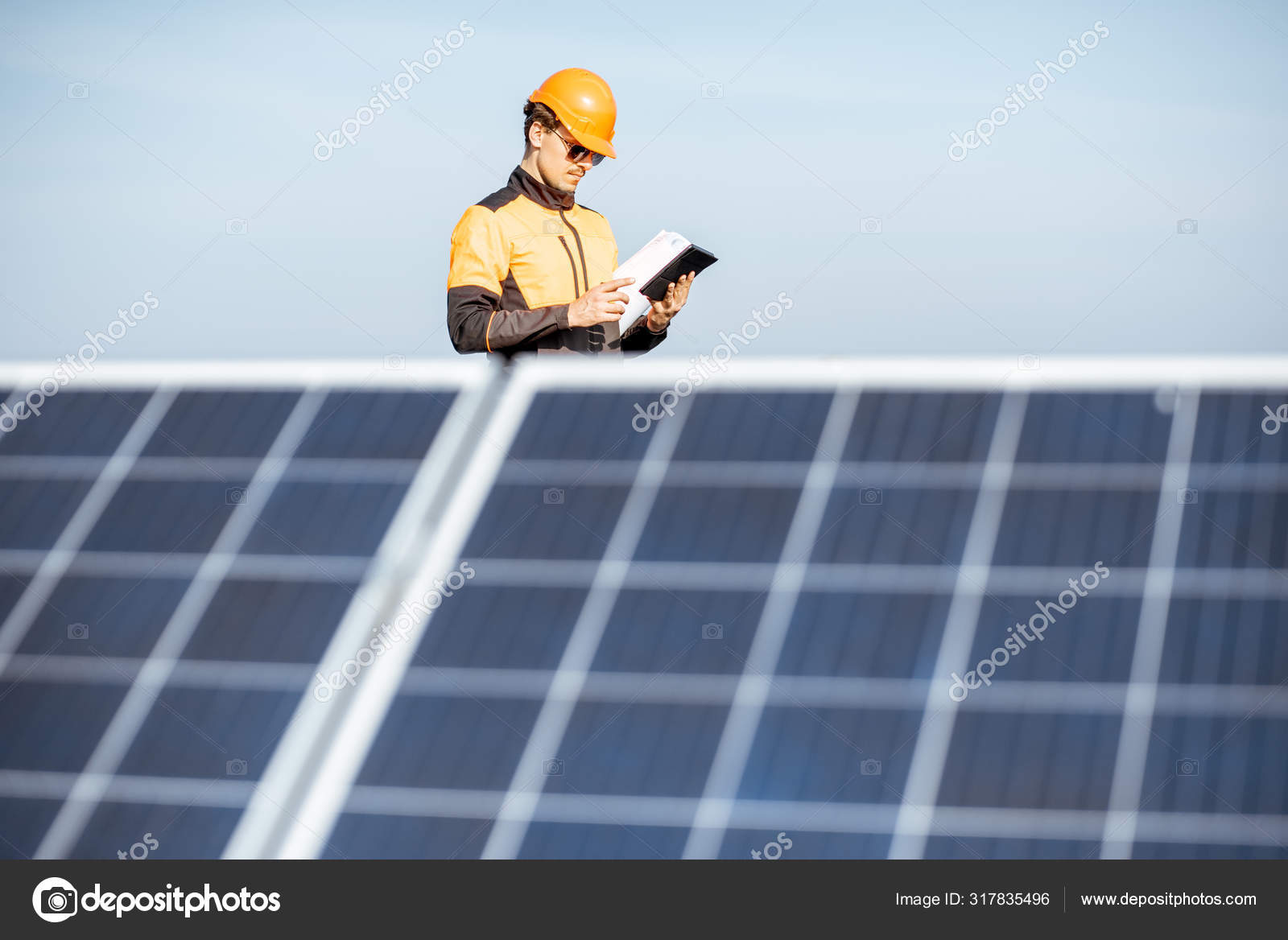 Engineer servicing solar panel on electric plant Stock Photo by ...