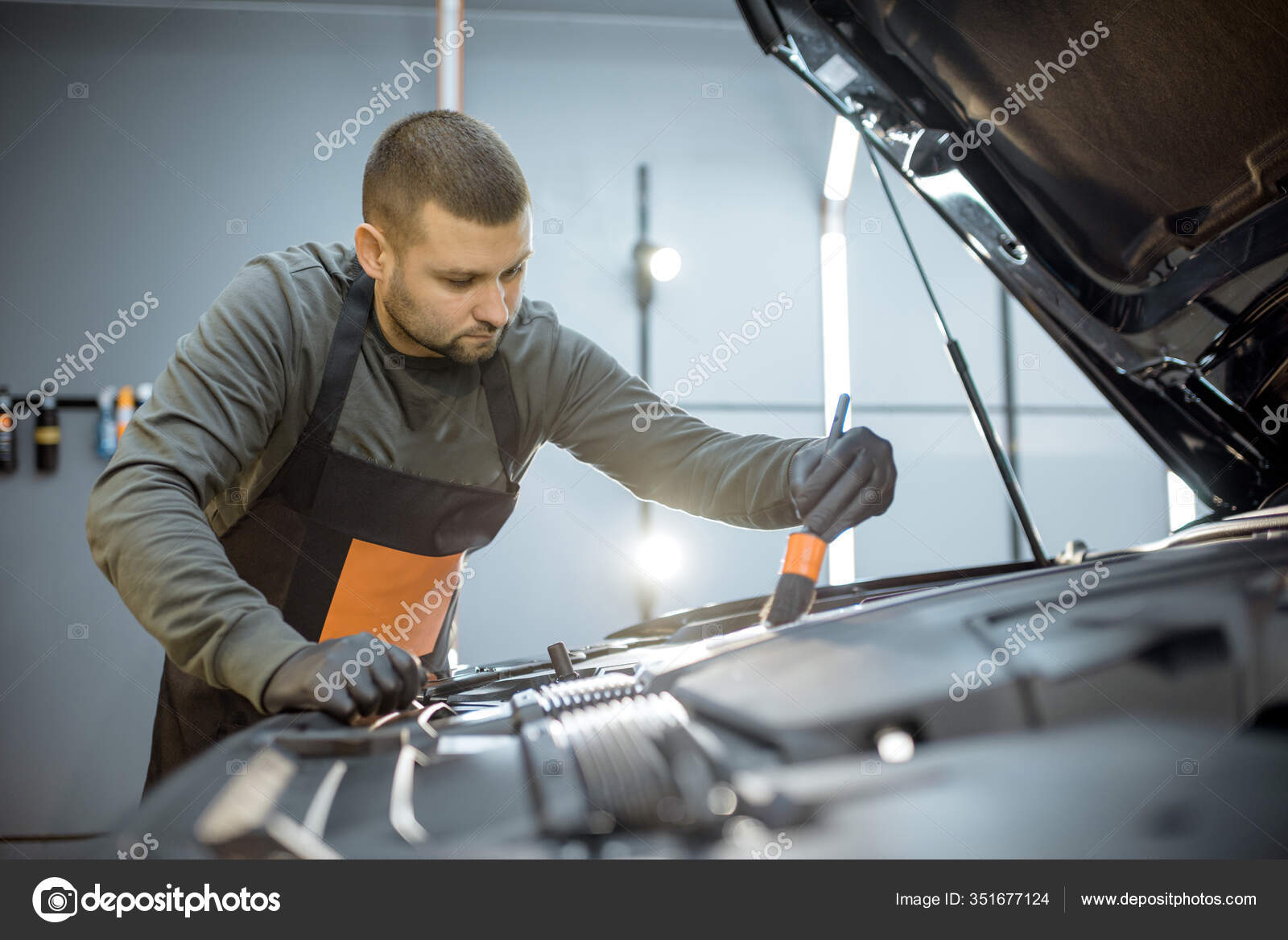 Professional car engine cleaning Stock Photo by ©rossandhelen 351677124
