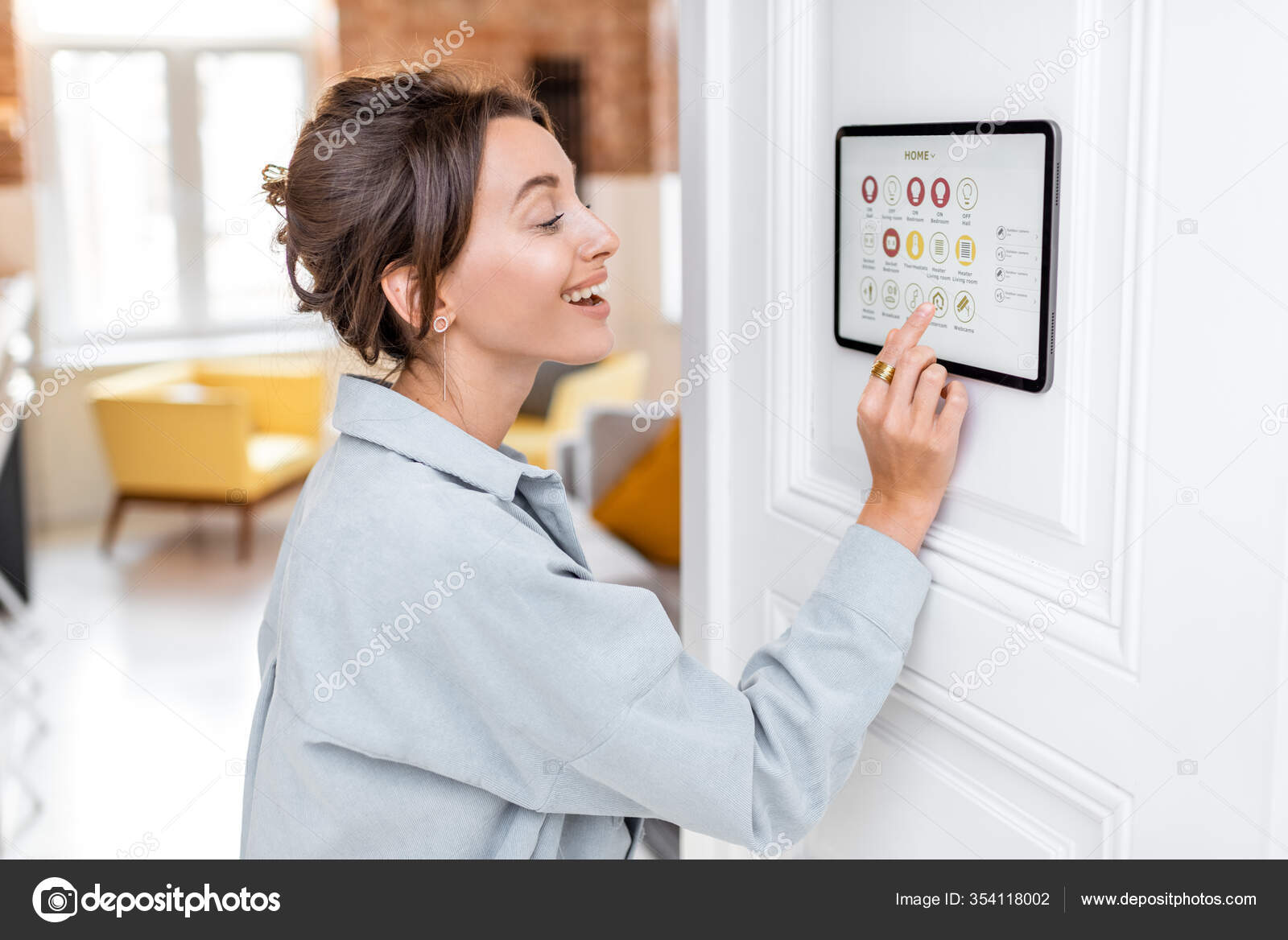 Woman controlling home with a digital touch screen Stock Photo by ...