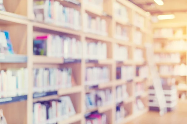 Blurred bookshelf in library room Stock Photo by ©jakkapan 159485584
