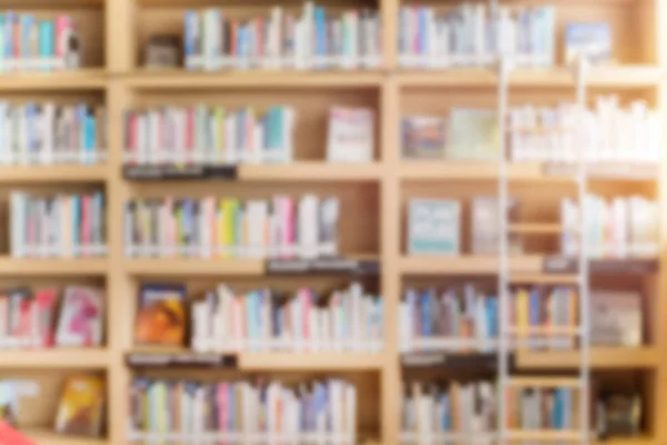 Blurred bookshelf in library ⬇ Stock Photo, Image by © jakkapan #131494310