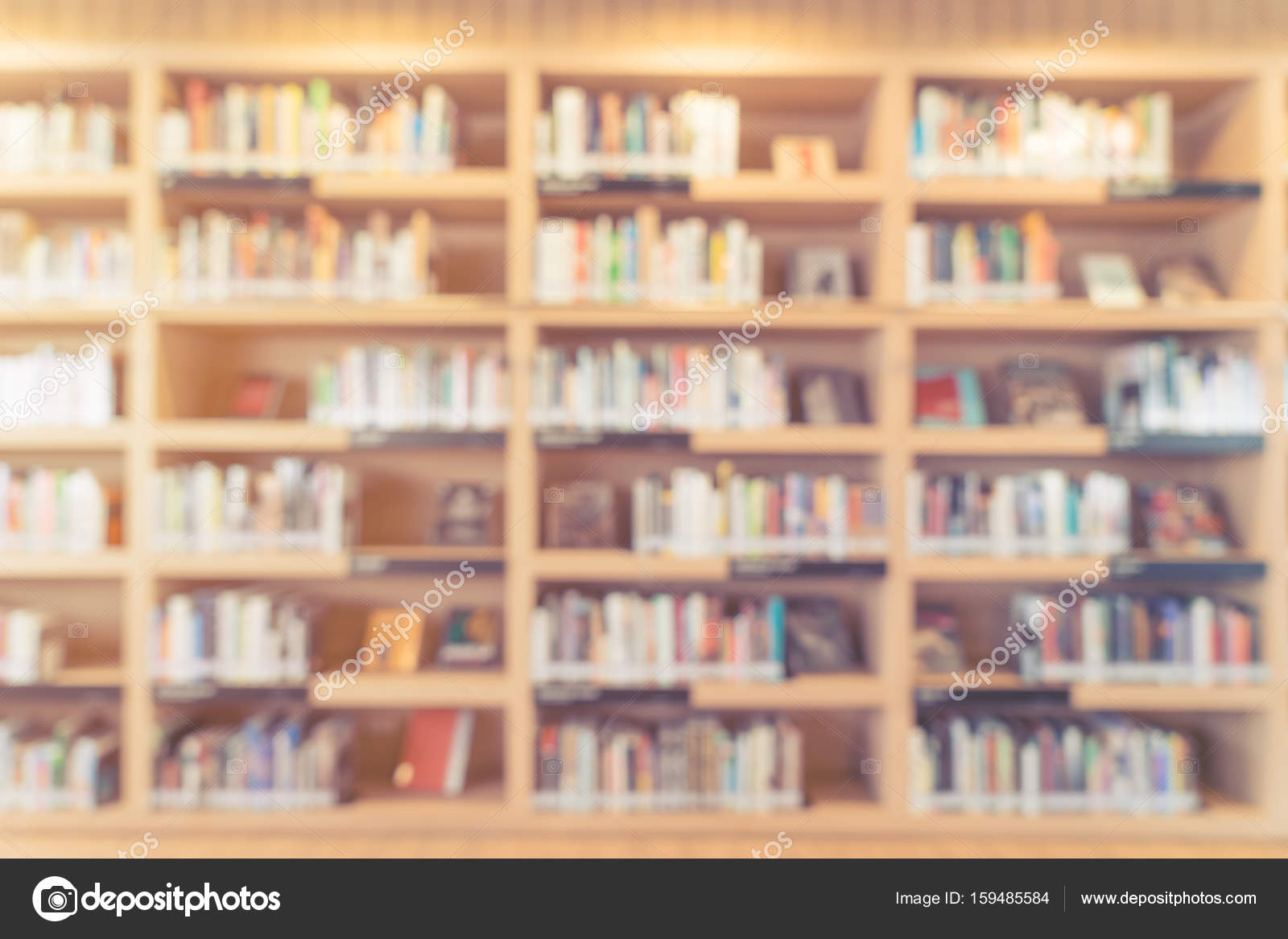 Blurred bookshelf in library room Stock Photo by ©jakkapan 159485584