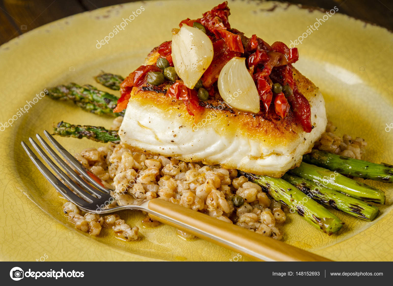 Fresh halibut filet on bed of farro — Stock Photo © TeriVirbickis ...