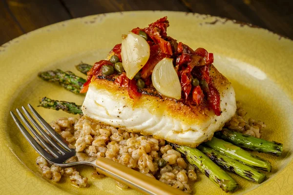 Fresh halibut filet on bed of farro — Stock Photo © TeriVirbickis ...