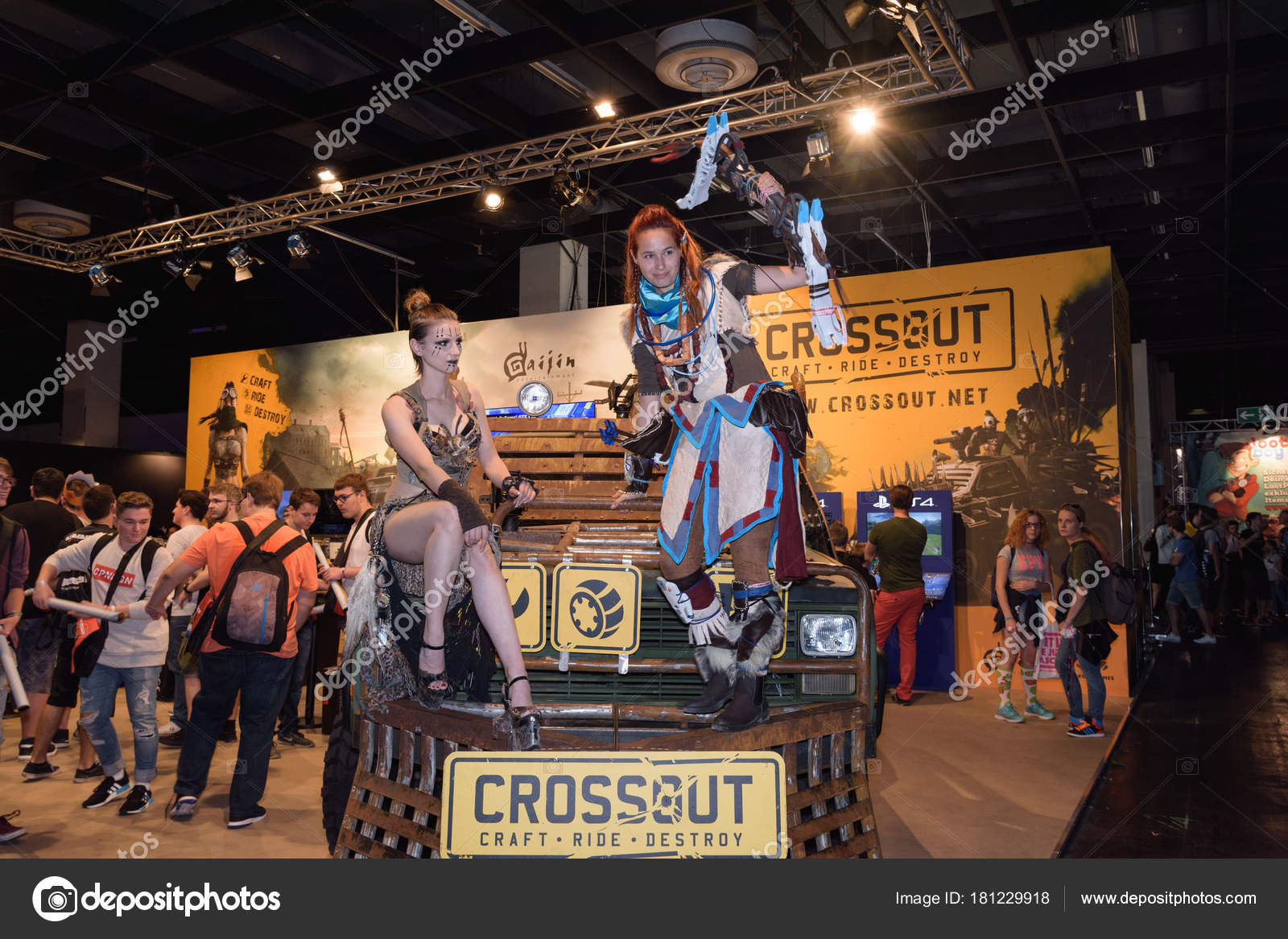 Two cosplayers pose at the booth of game Crossout at Gamescome – Stock ...