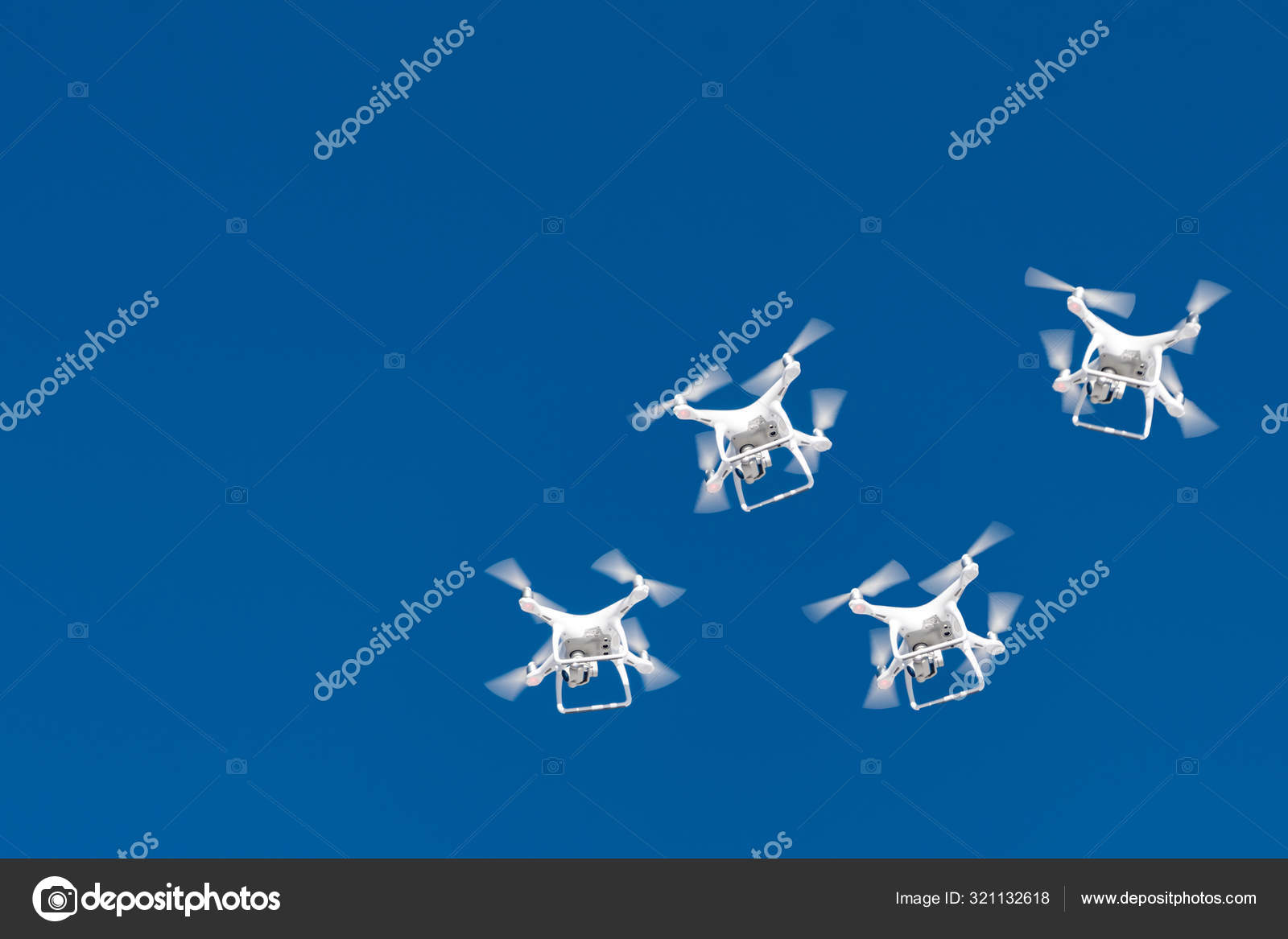 Dozens of drones swarm in the blue sky. Quadcopters drones with digital ...