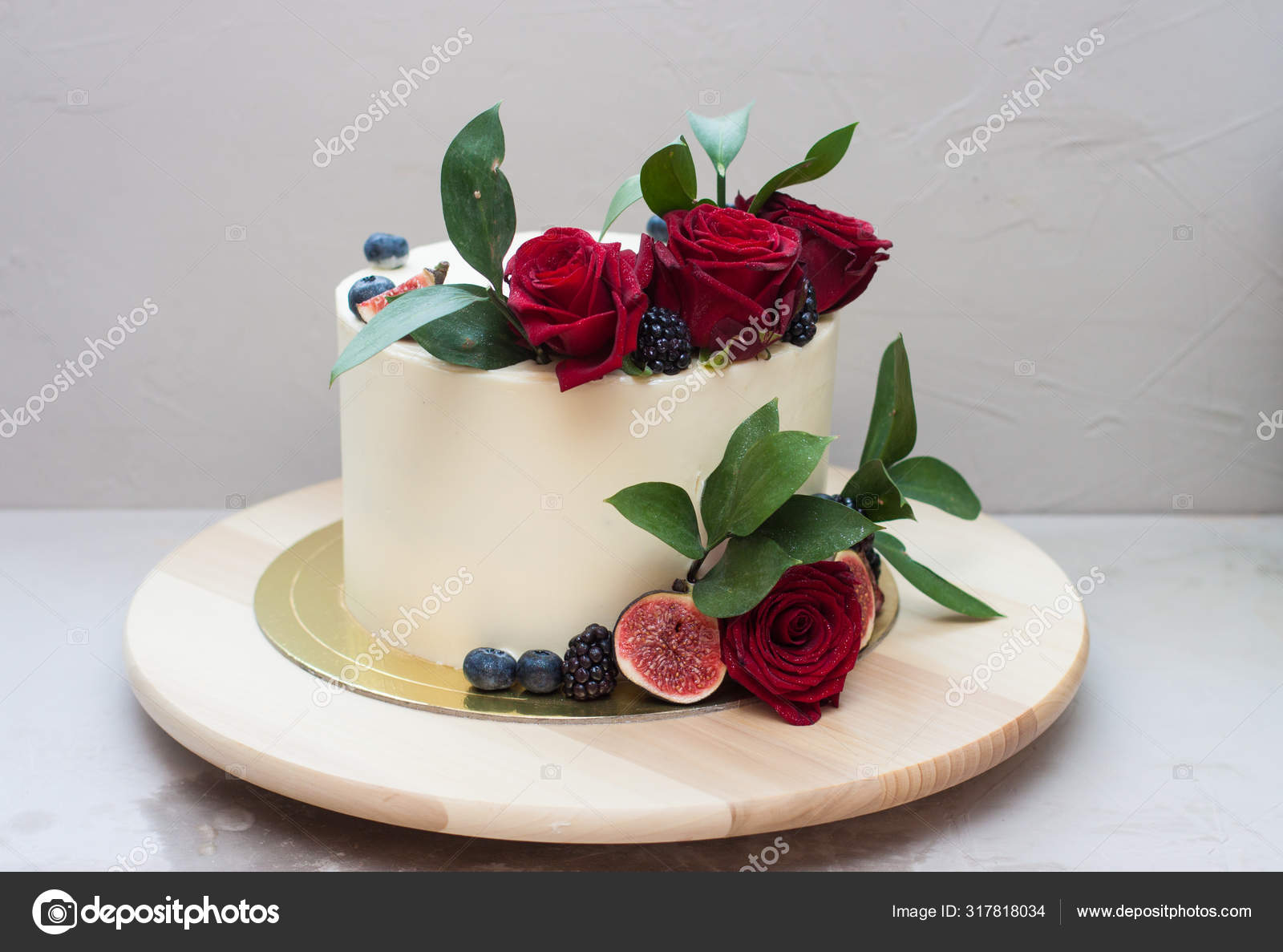 White Wedding Cake With Red Roses