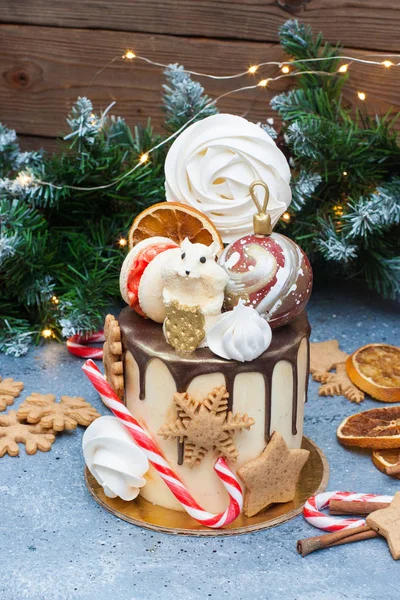 New Year cake with chocolate mouse, meringue, macaroons, candy cane ...