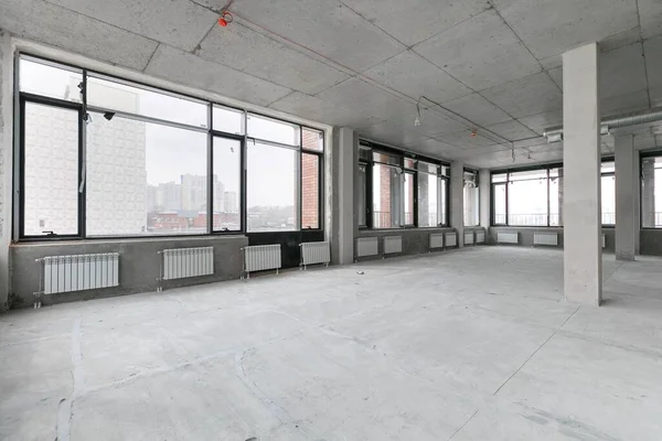 empty pure commercial office building undecorated in gray colors.open ...