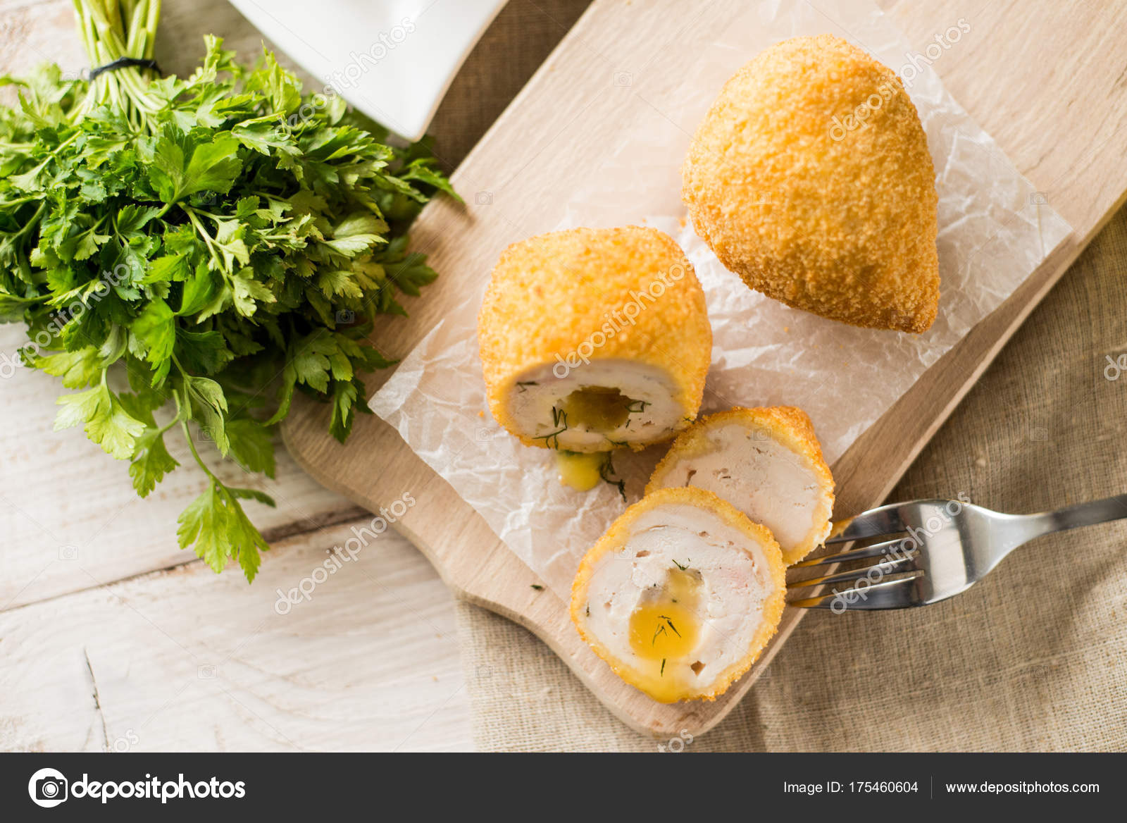 Chicken Kiev cutlets with parsley leaves and butter Stock Photo by ...