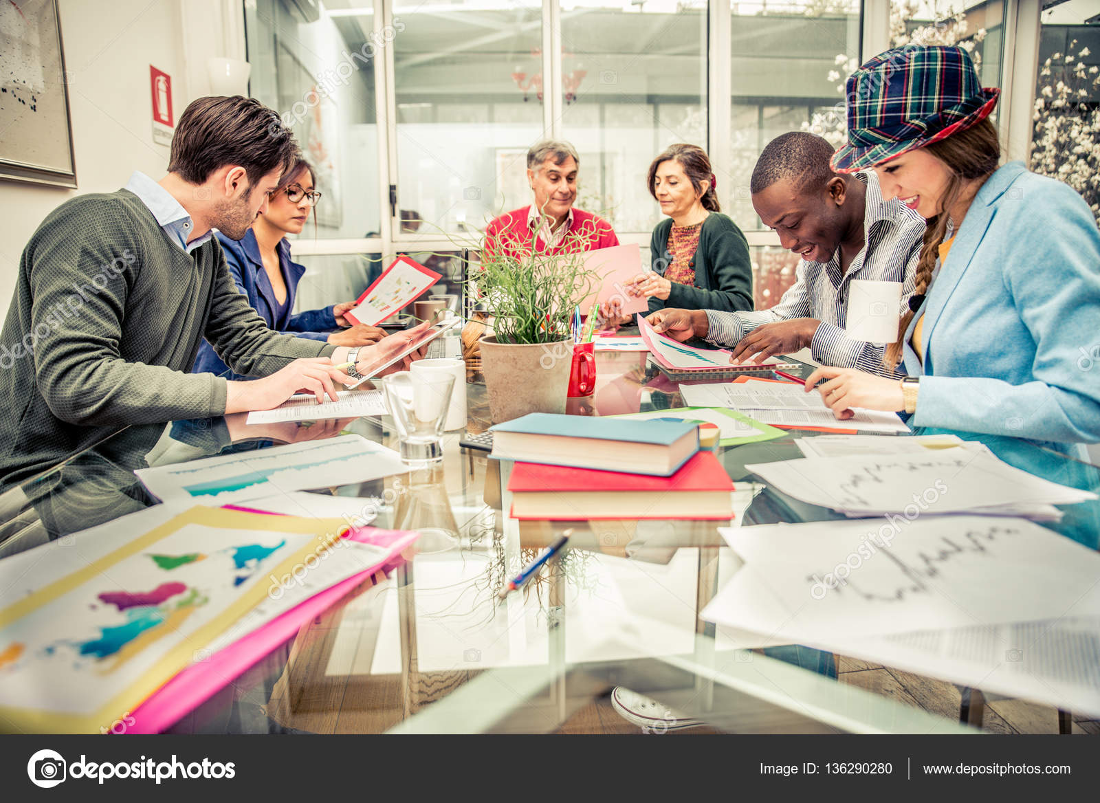 Creative team brainstorming in modern office Stock Photo by ...
