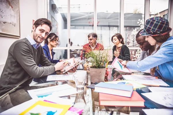 Creative team brainstorming in modern office Stock Photo by ...