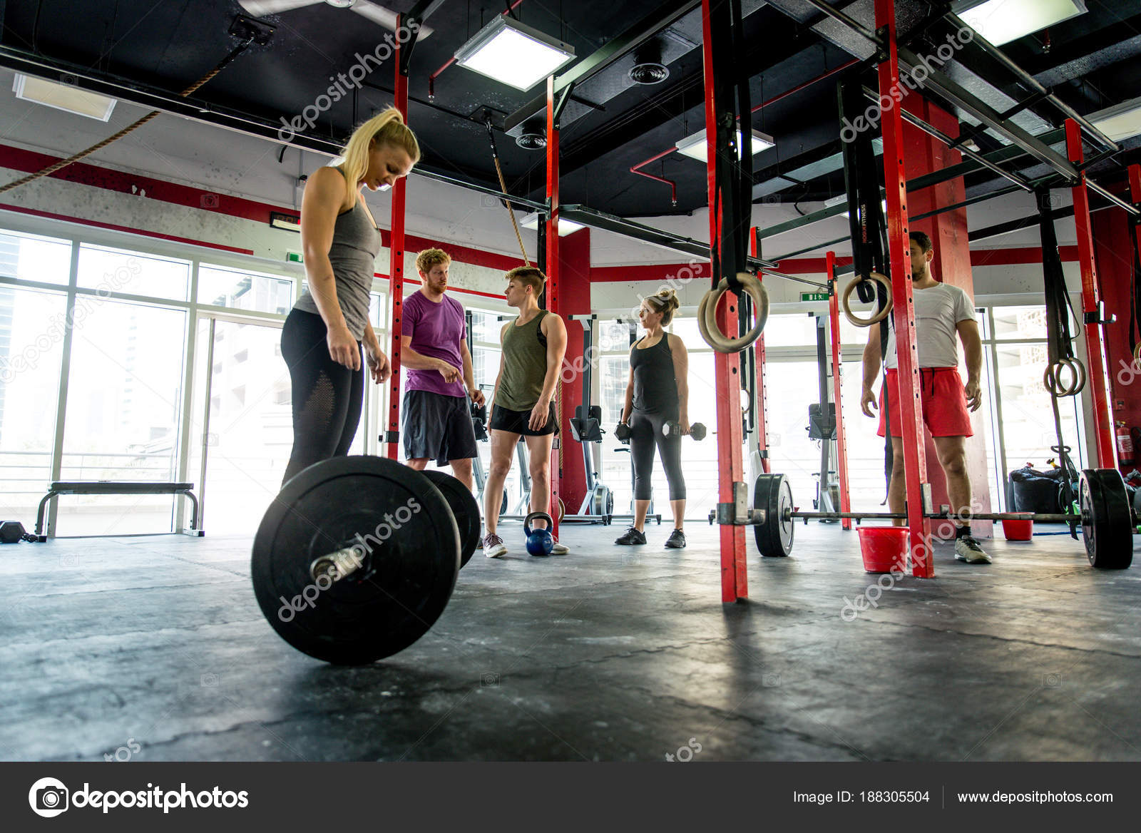 Athletes training in a cross-fit gym Stock Photo by ©oneinchpunch 188305504