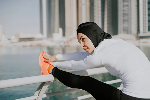 Arabic woman runner, making some urban running - Stock Image - Everypixel