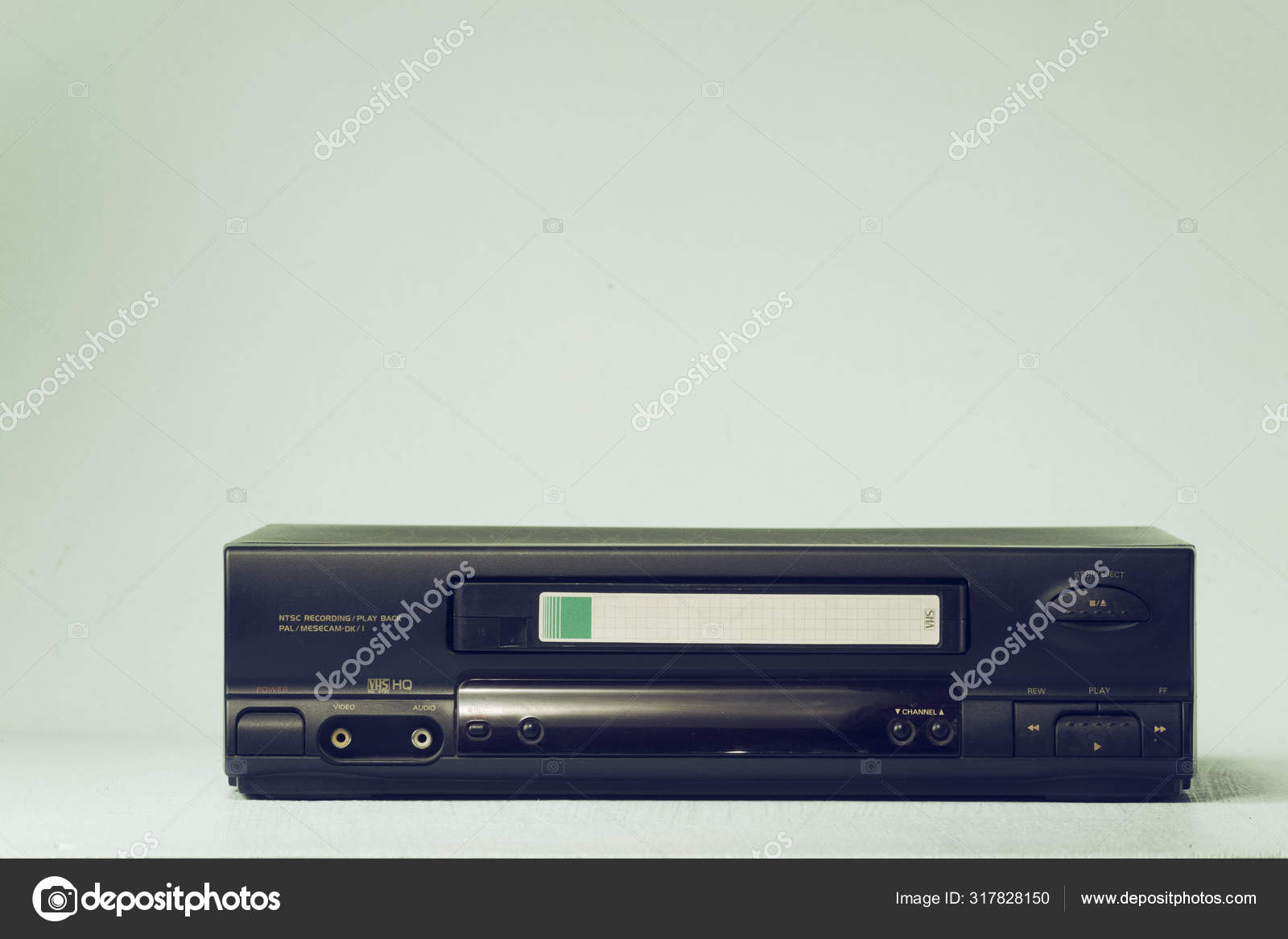 VHS video recorder Retro video recorder with video cassette on a light ...