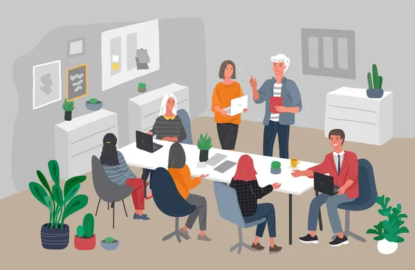 Office or coworking interior workers sitting at desks and communicating ...