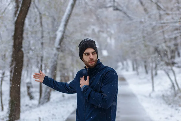 Young athlete doing warm-up in cold winter weather - Stock Image ...