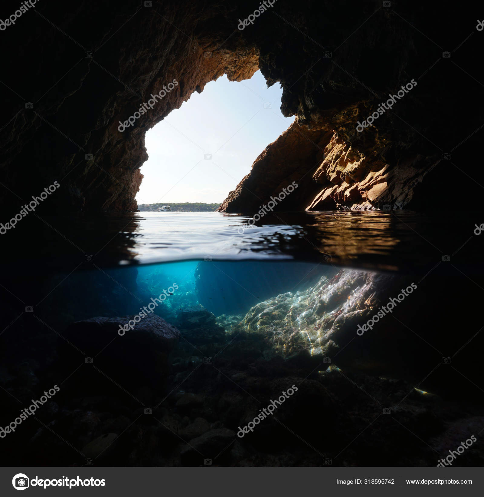 Inside a sea cave on shore split over under water Stock Photo by ...