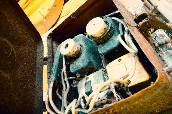 Overloaded electrical circuit causing electrical short and fire. Old ...