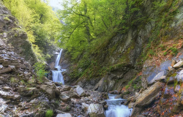 Three-stage waterfall in the spring in the mountains - Stock Image ...