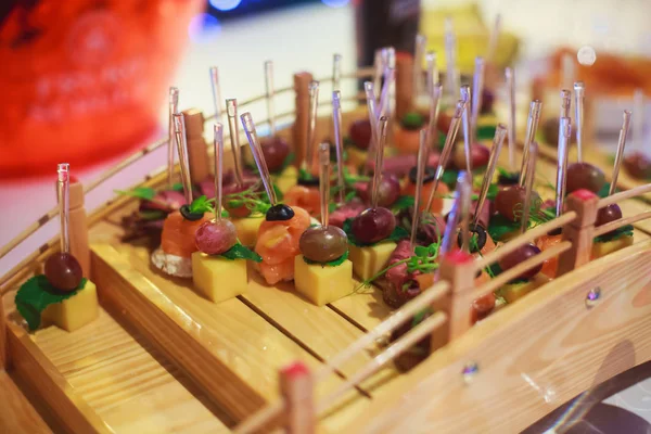 Beautifully decorated catering banquet table with different food snacks ...
