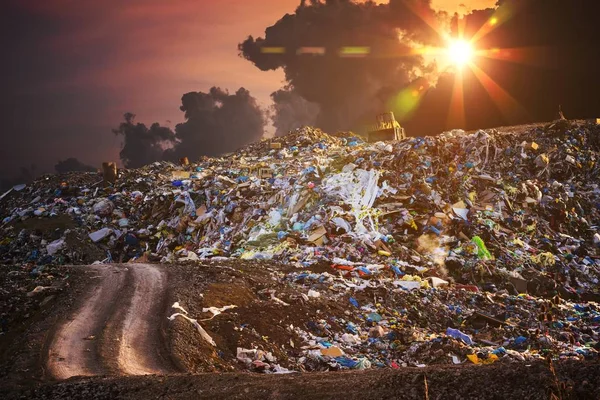 Pollution concept. Garbage pile in trash dump or landfill at sun Stock ...