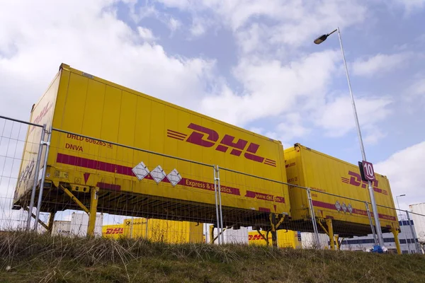 DHL and DPD shipping containers in front of Amazon logistics building ...