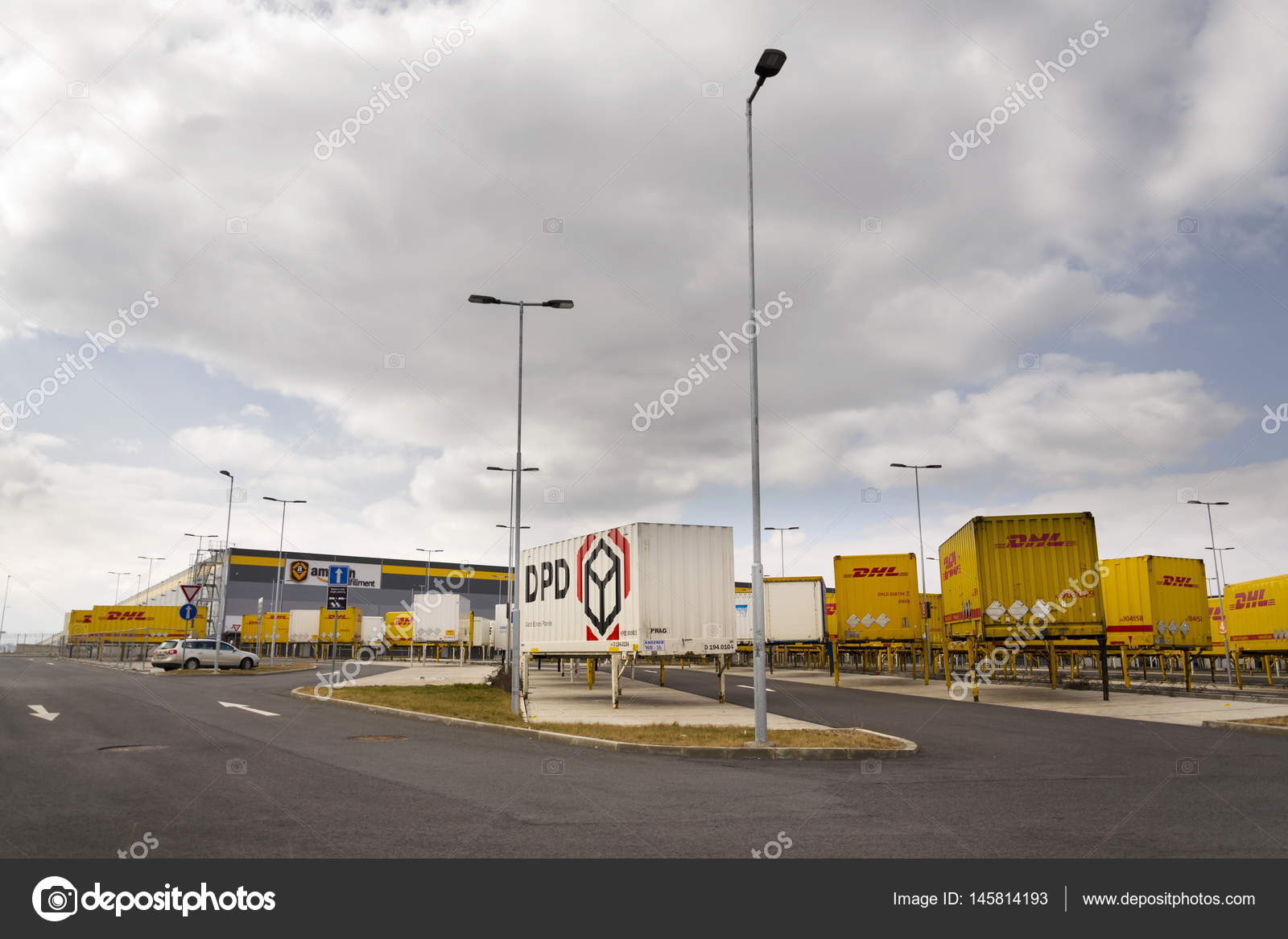 DHL and DPD shipping containers in front of Amazon logistics building ...