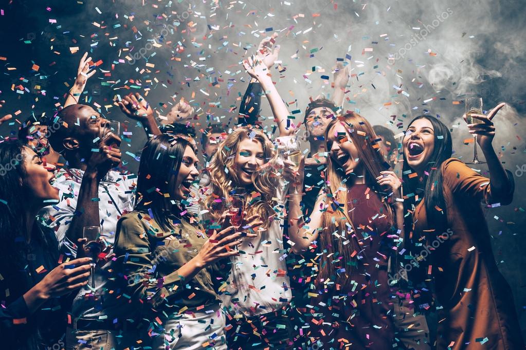 People dancing at party with confetti — Stock Photo © gstockstudio ...
