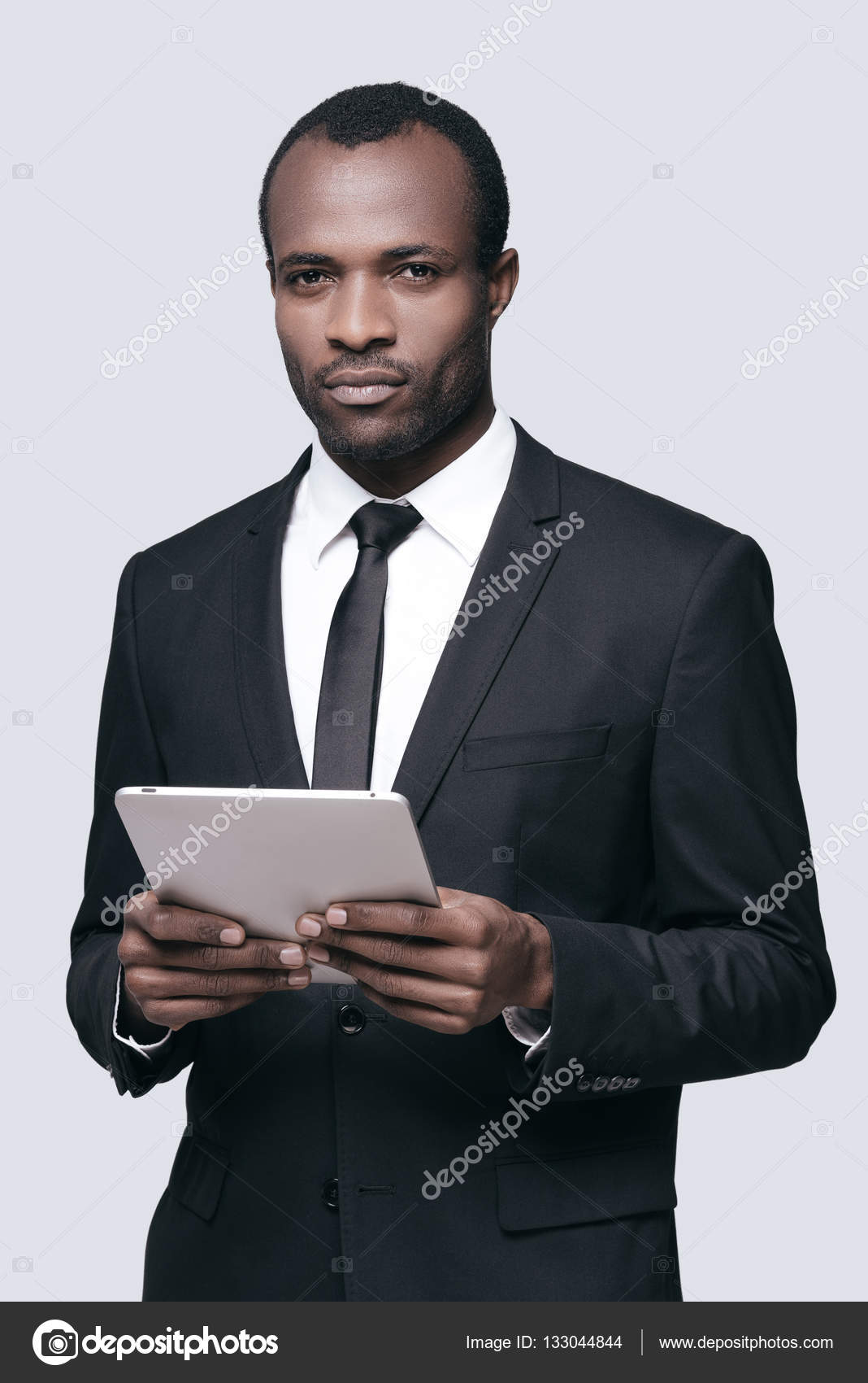 Man working on digital tablet Stock Photo by ©gstockstudio 133044844