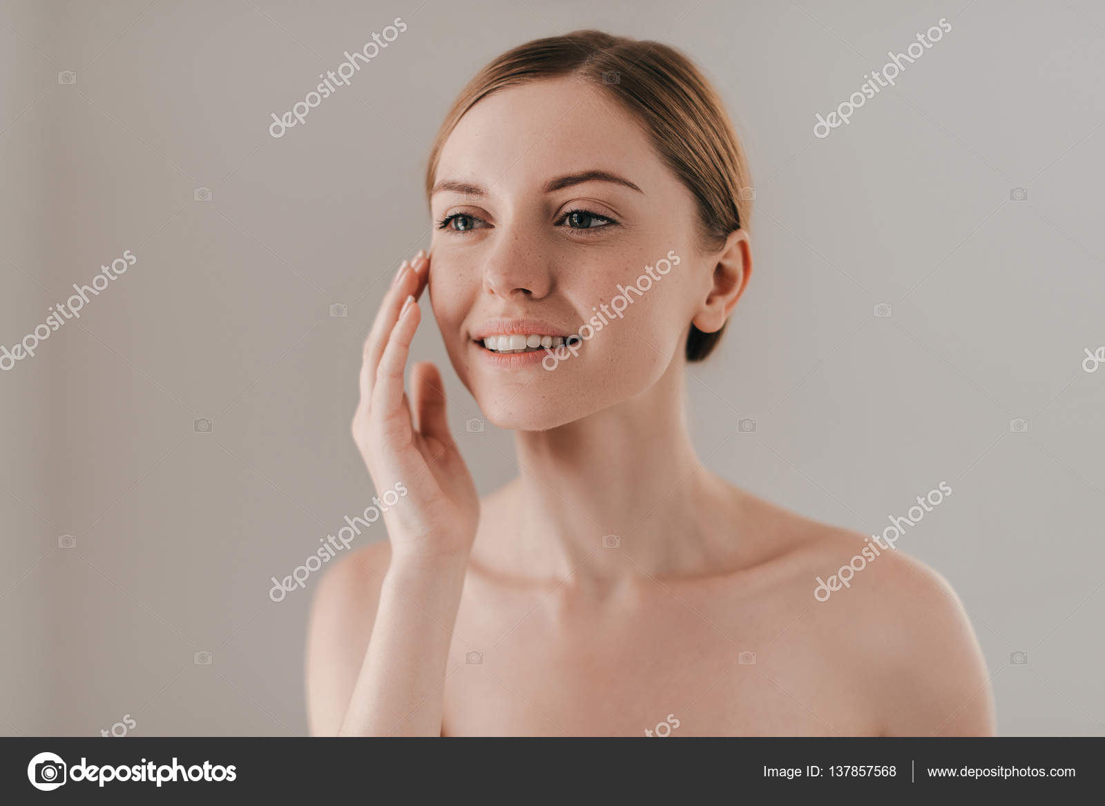 Attractive woman enjoying her softness skin Stock Photo by ...