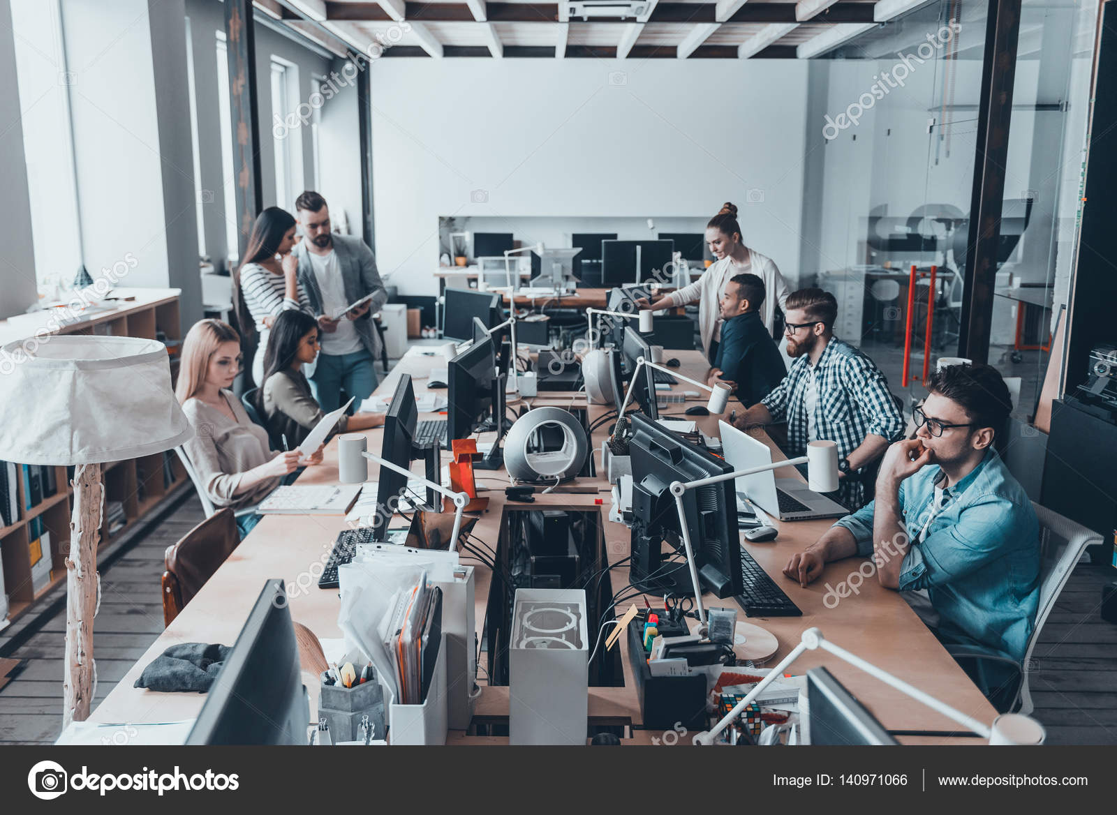 Successful team working in office — Stock Photo © gstockstudio #140971066