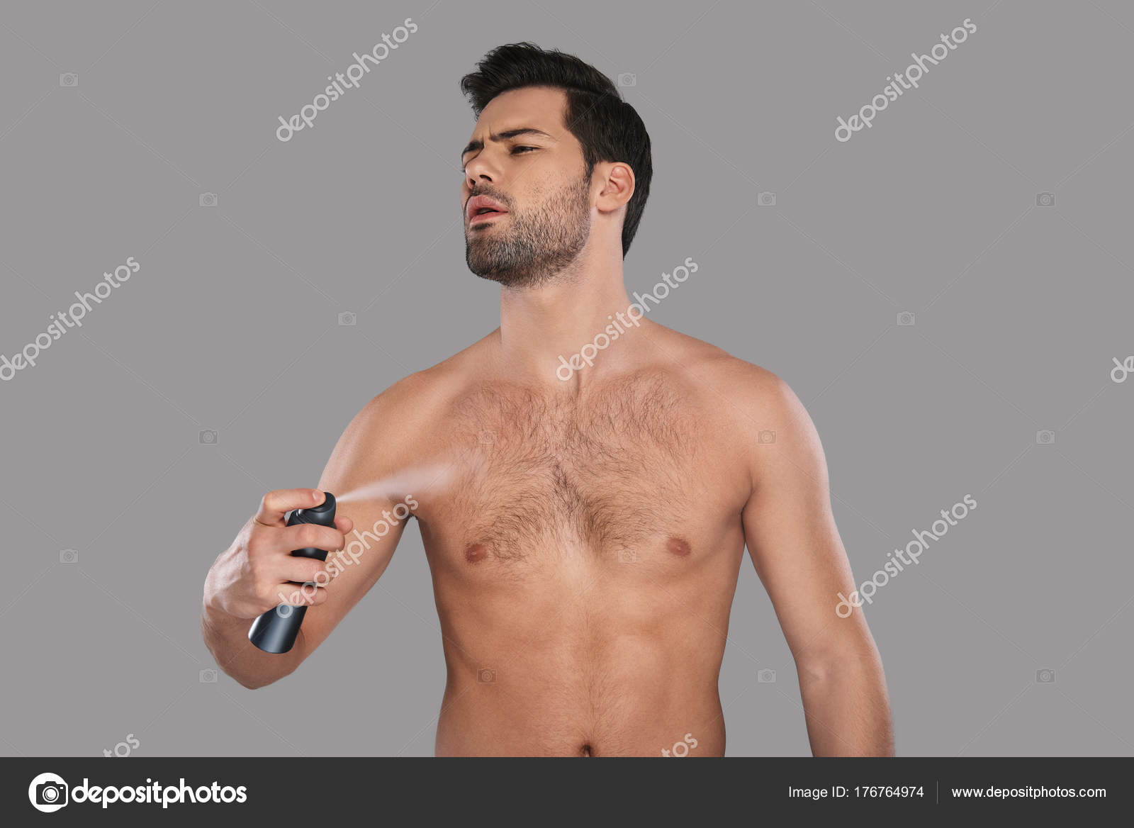 Shirtless Handsome Young Man Applying Deodorant While Standing Grey ...