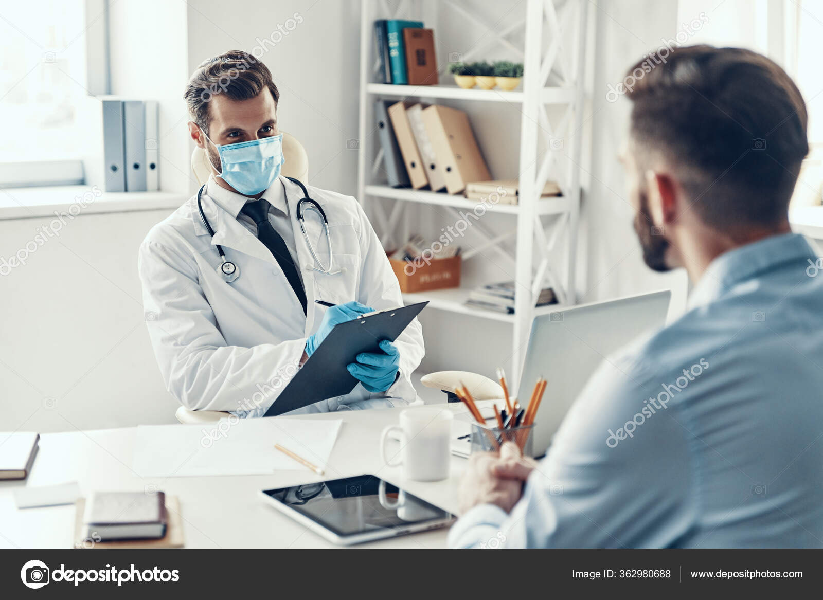 Concentrated Doctor White Lab Writing Something Talking His Patient ...