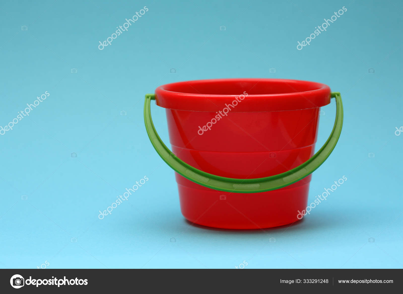 Red Bucket Green Background — Stock Photo © PantherMediaSeller #333291248