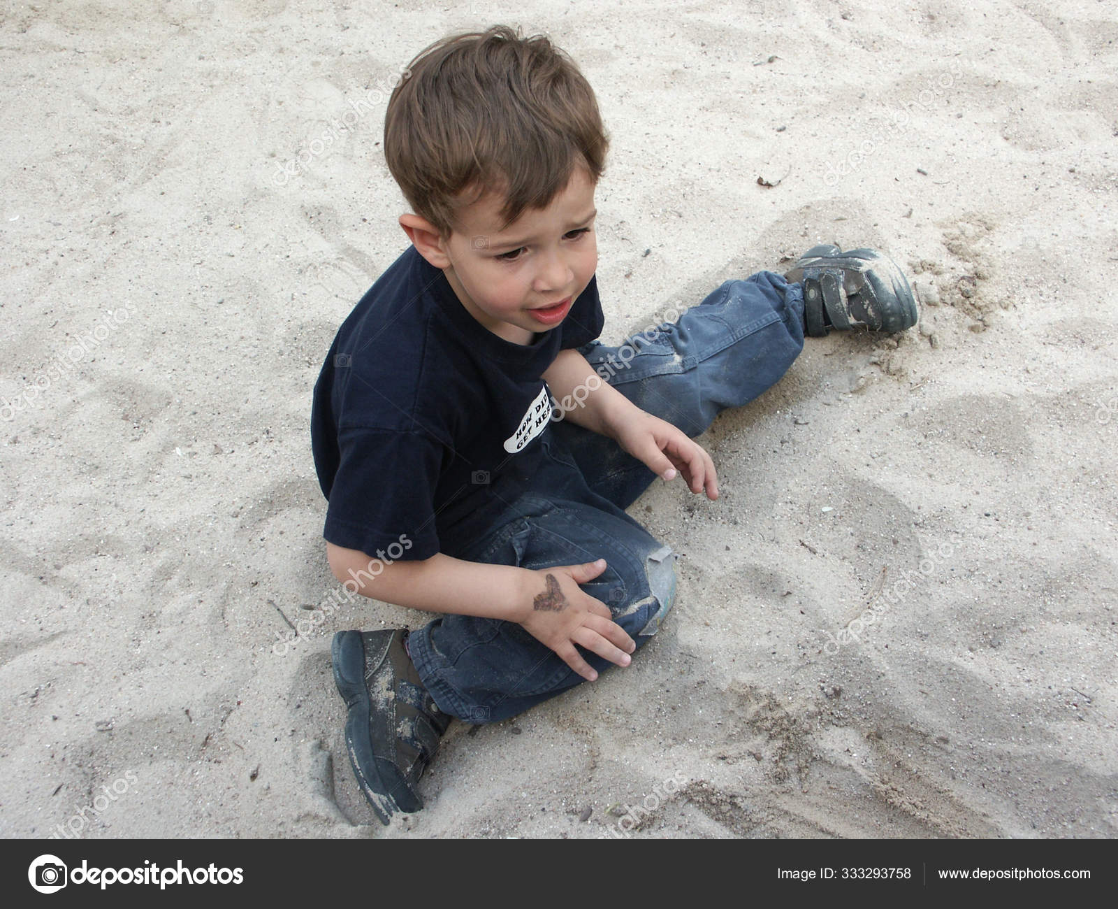 Boy Playing Sand Stock Photo by ©PantherMediaSeller 333293758