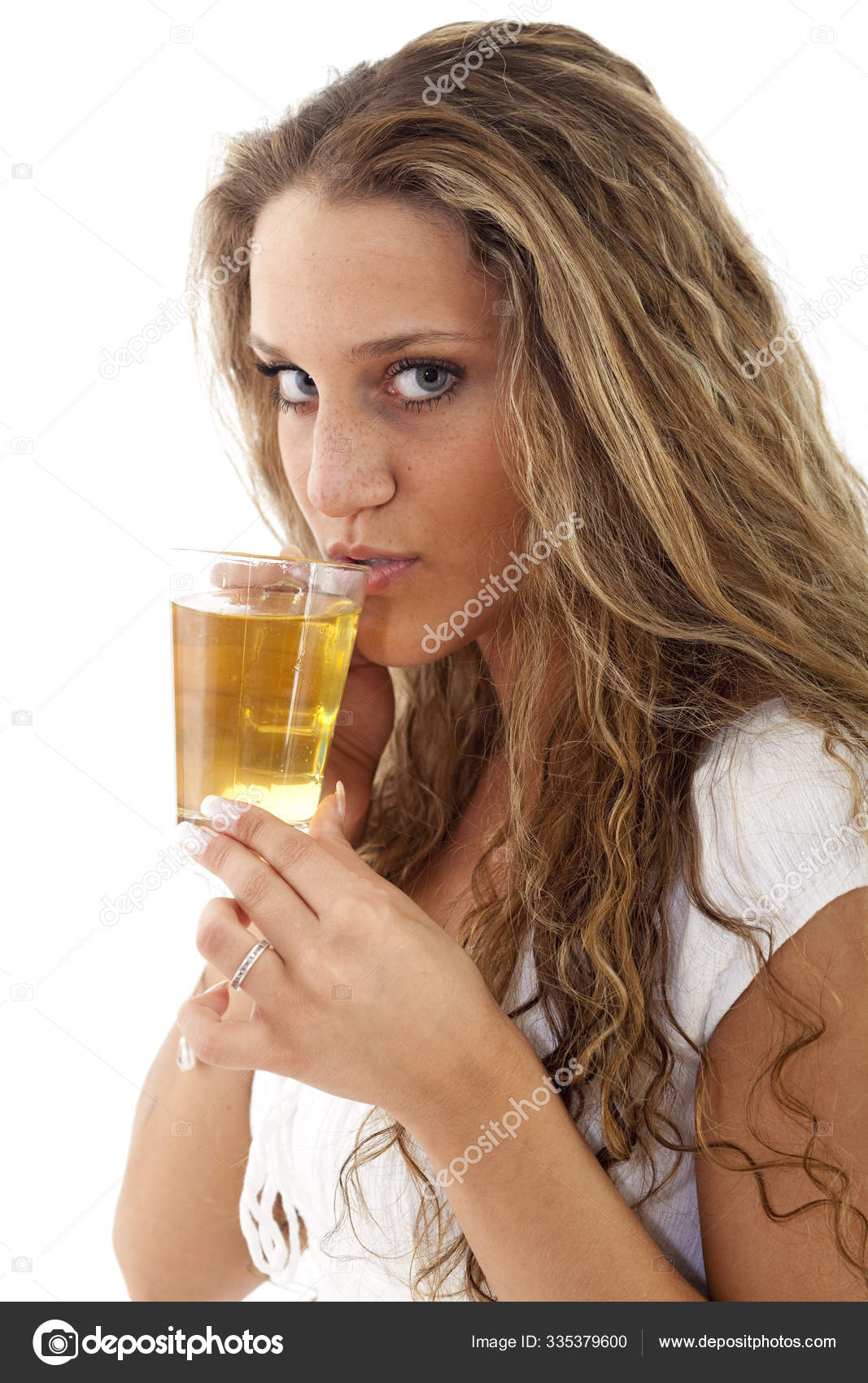 Young Woman Drinking Tea — Stock Photo © PantherMediaSeller #335379600