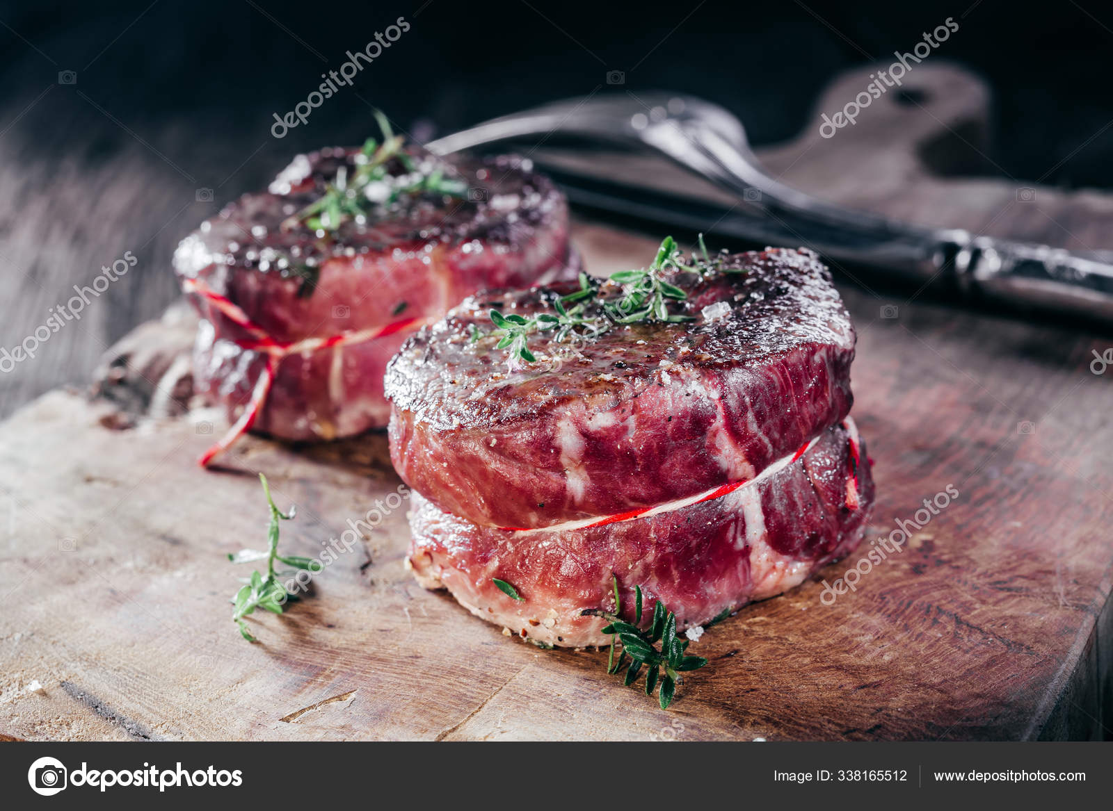 Close Two Rare Venison Steak Filets Seasoned Fresh Herbs Wooden Stock ...