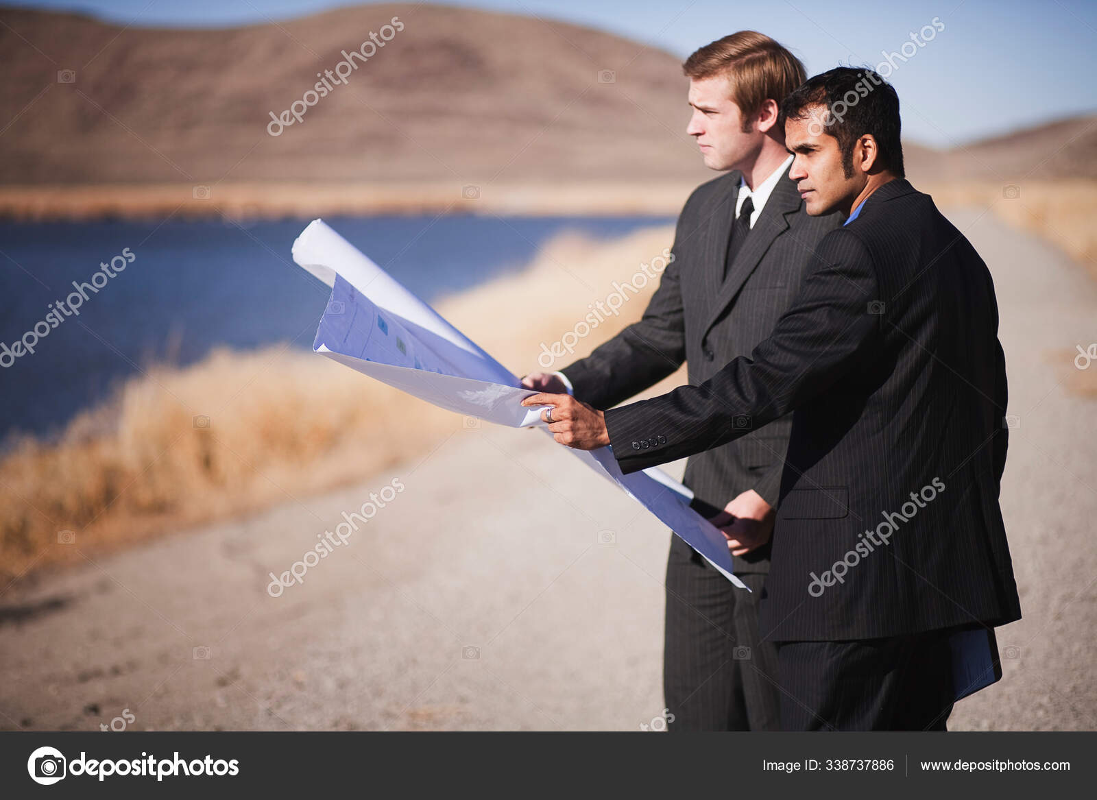 Men Blueprints Looking Water Stock Photo by ©PantherMediaSeller 338737886