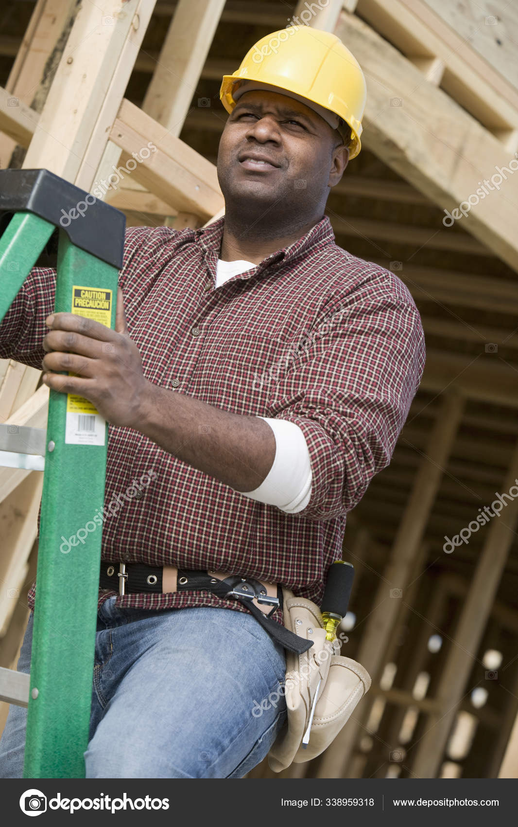 Worker Climbing Ladder
