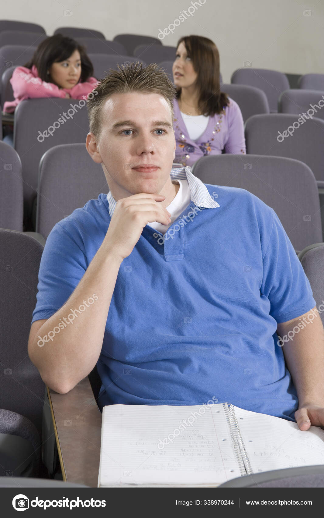 Male Student Concentrating Two Female Students Sitting Back — Stock ...